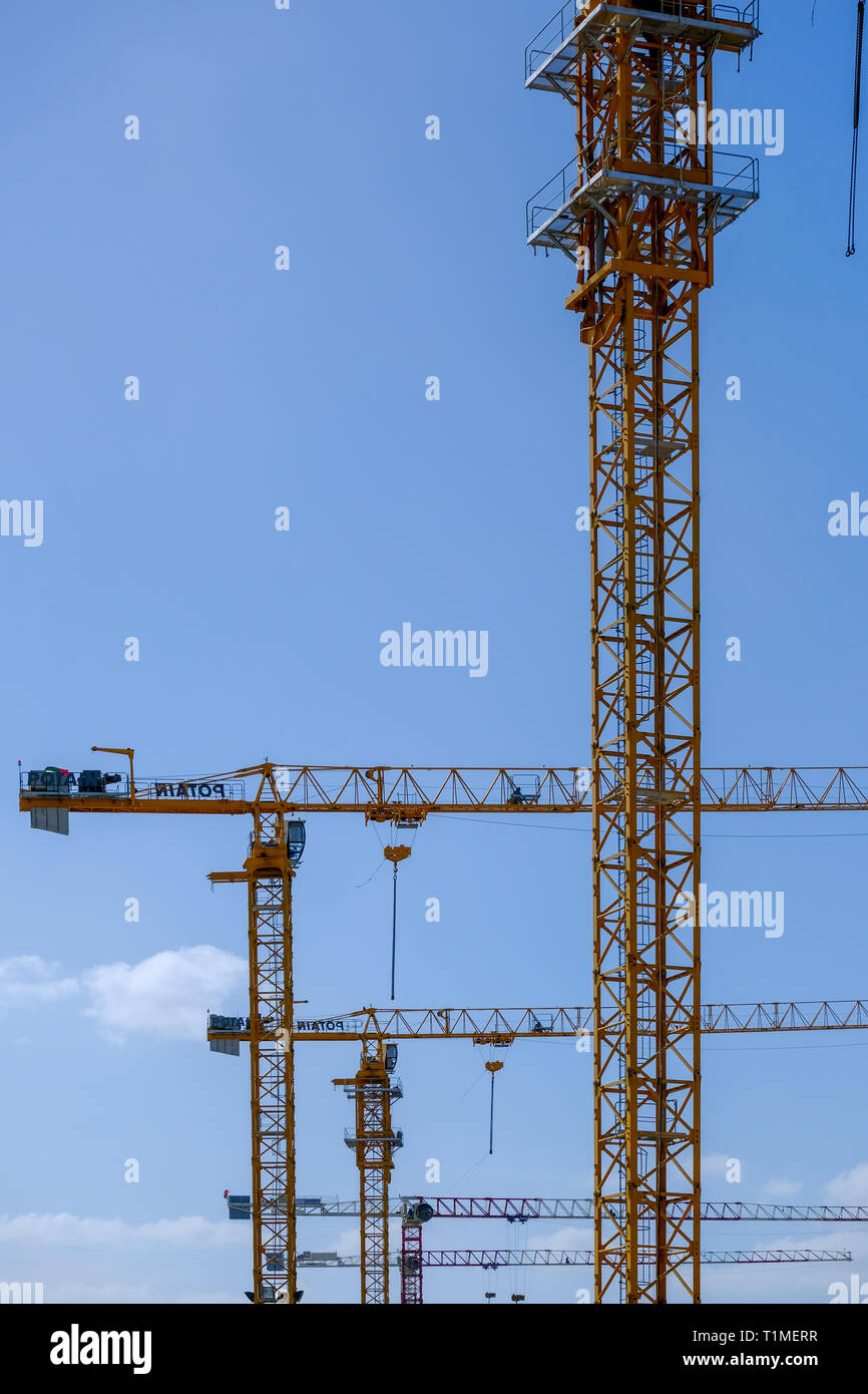 Row of tower crane at construction site Stock Photo - Alamy