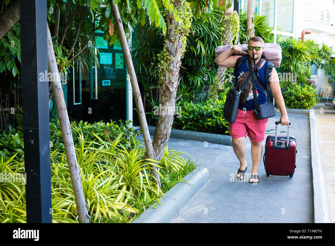 Man Carrying Heavy Bags High Resolution Stock Photography and Images ...