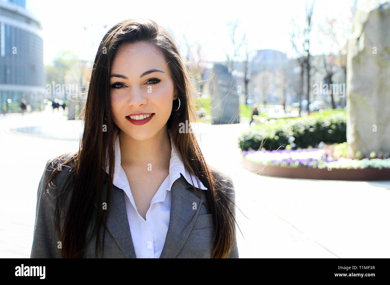 Confident young female manager outdoor in a modern urban setting Stock ...