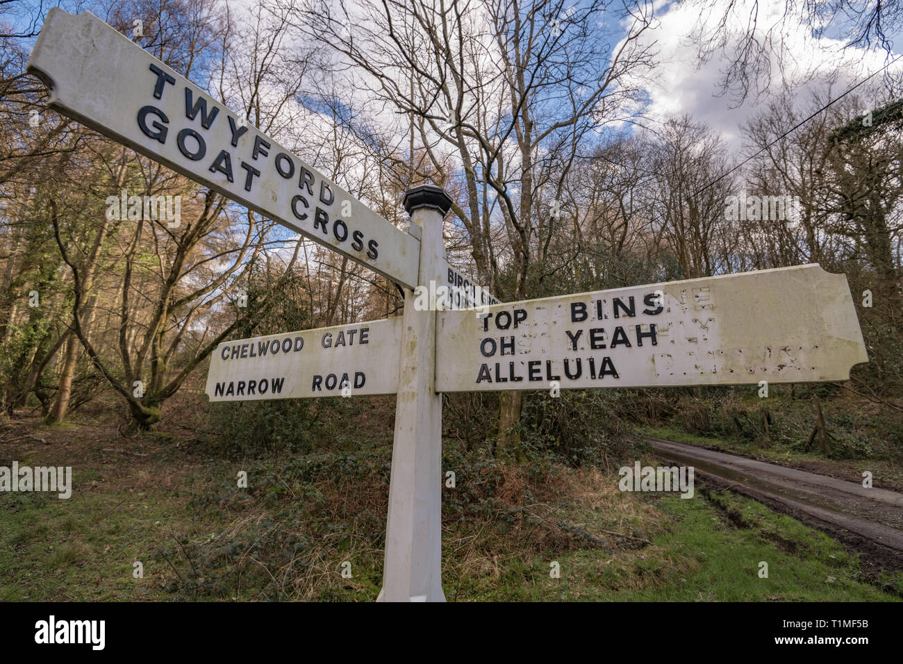 Rural sign post with letters reorganised Stock Photo - Alamy