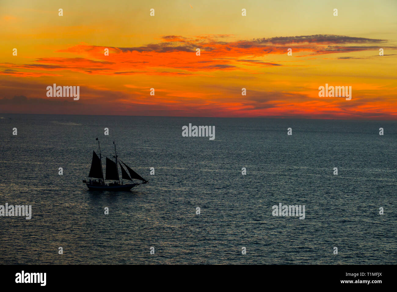 Tall ship tourist sail boat at sunset at Key West, a U.S. island city ...