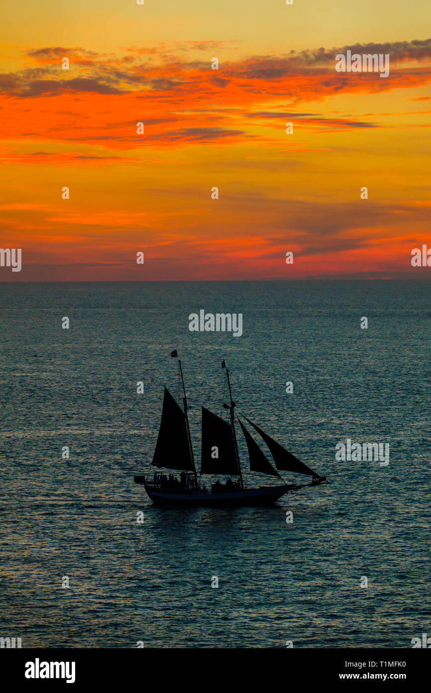 Tall ship tourist sail boat at sunset at Key West, a U.S. island city ...