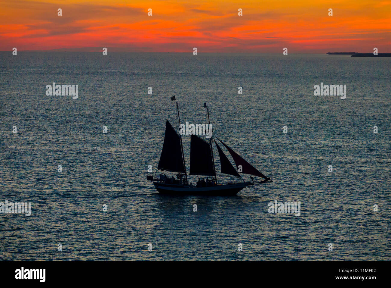 Tall ship tourist sail boat at sunset at Key West, a U.S. island city ...
