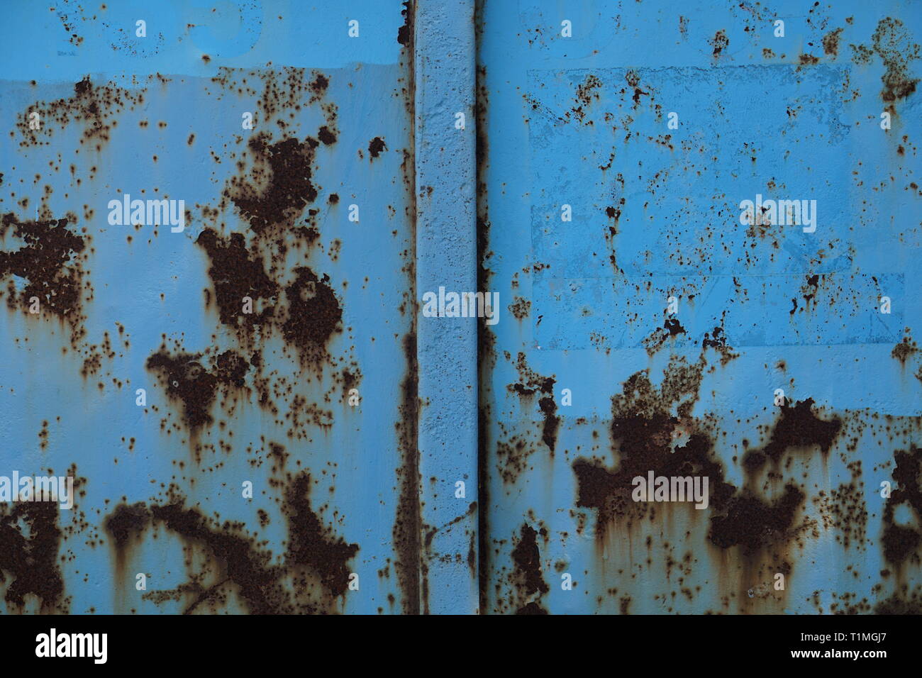 Blue background - rusty container Stock Photo - Alamy