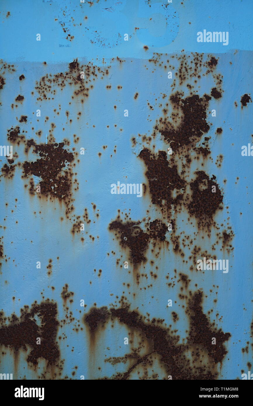 Blue background - rusty container Stock Photo - Alamy