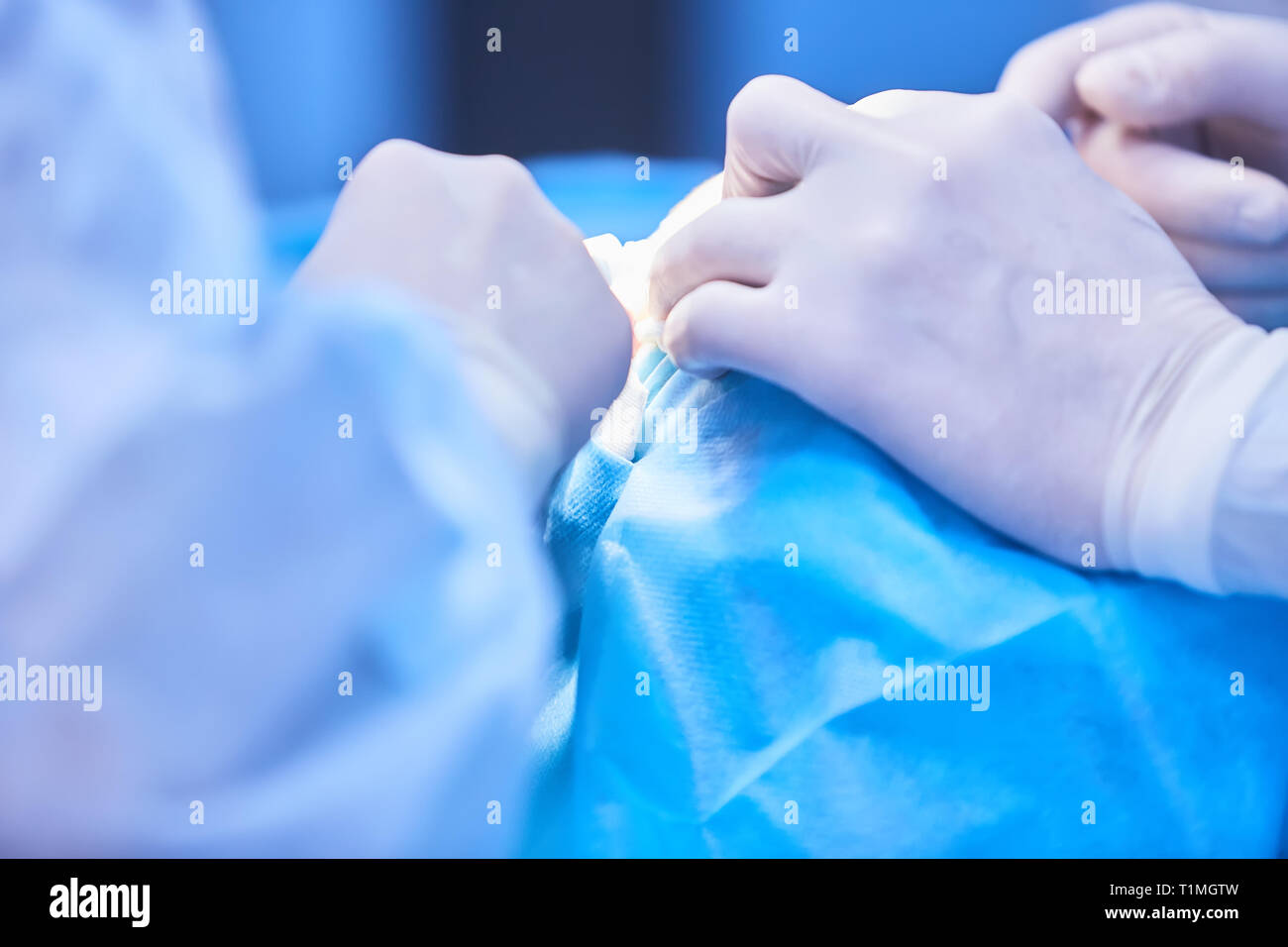 Medical team of surgeons in hospital doing minimal invasive surgical ...