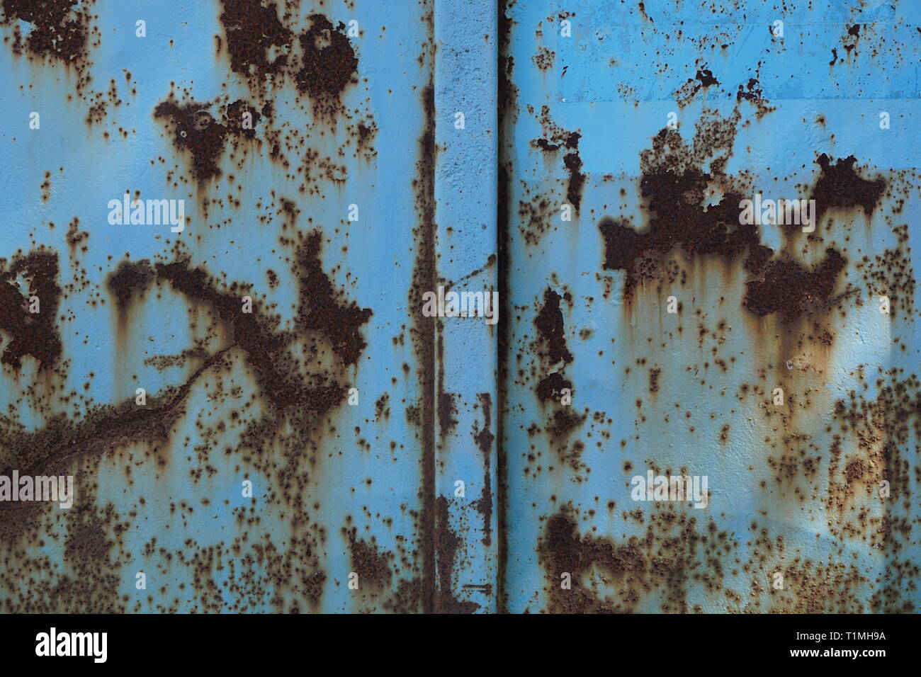 Blue background - rusty container Stock Photo - Alamy