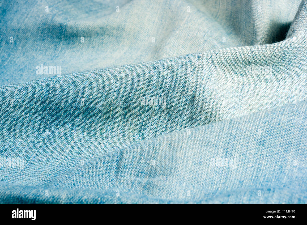 Blue washed faded jeans texture with seams, clothing items, macro ...