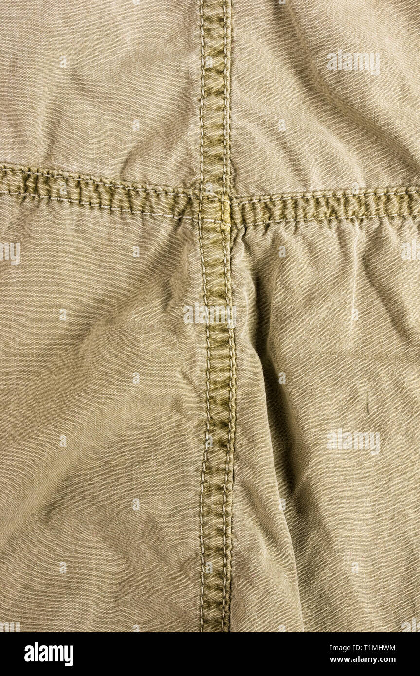 clothing items washed cotton fabric texture with seams, macro, close-up ...