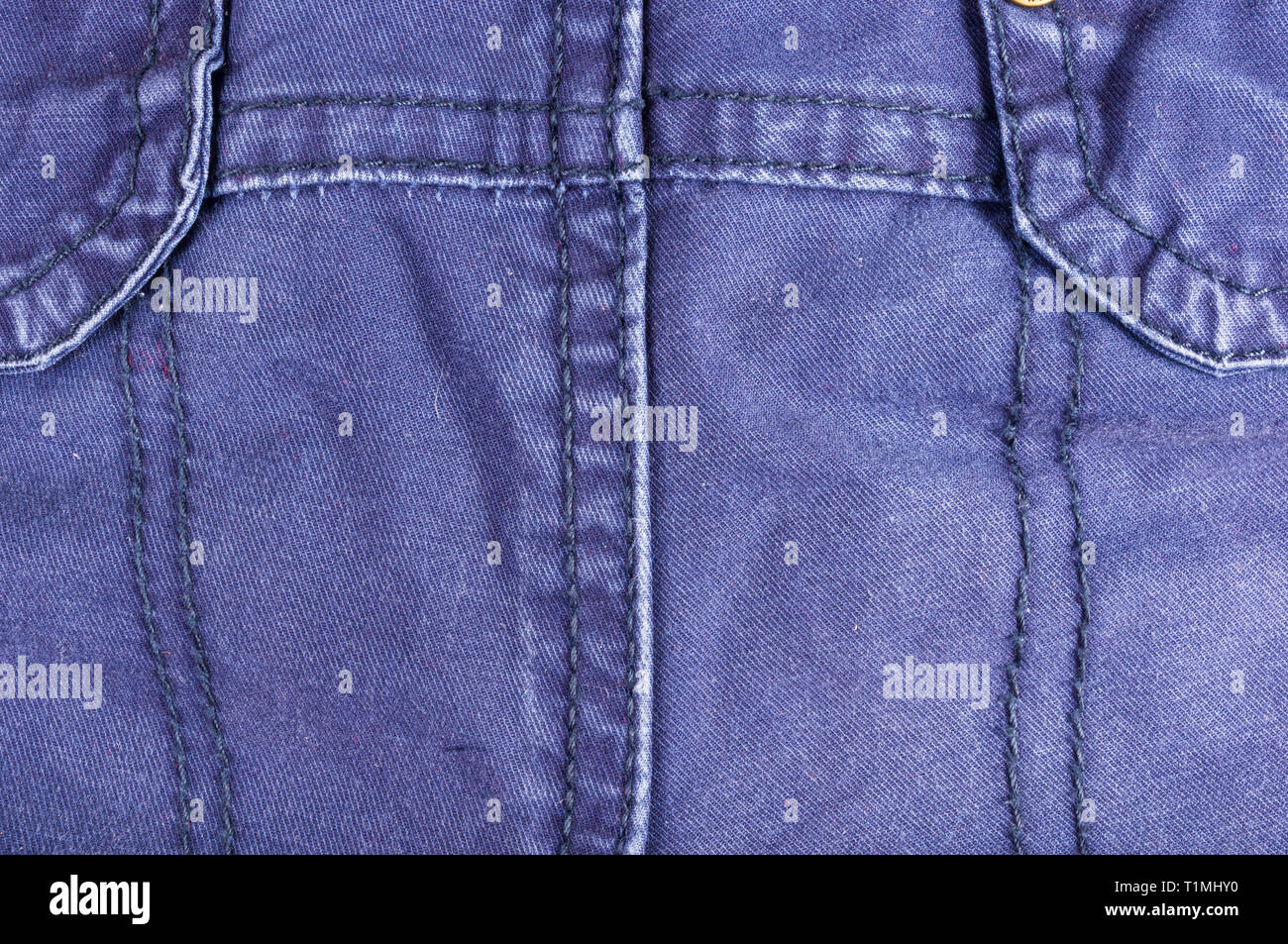 clothing items washed cotton fabric texture with seams, macro, close-up ...