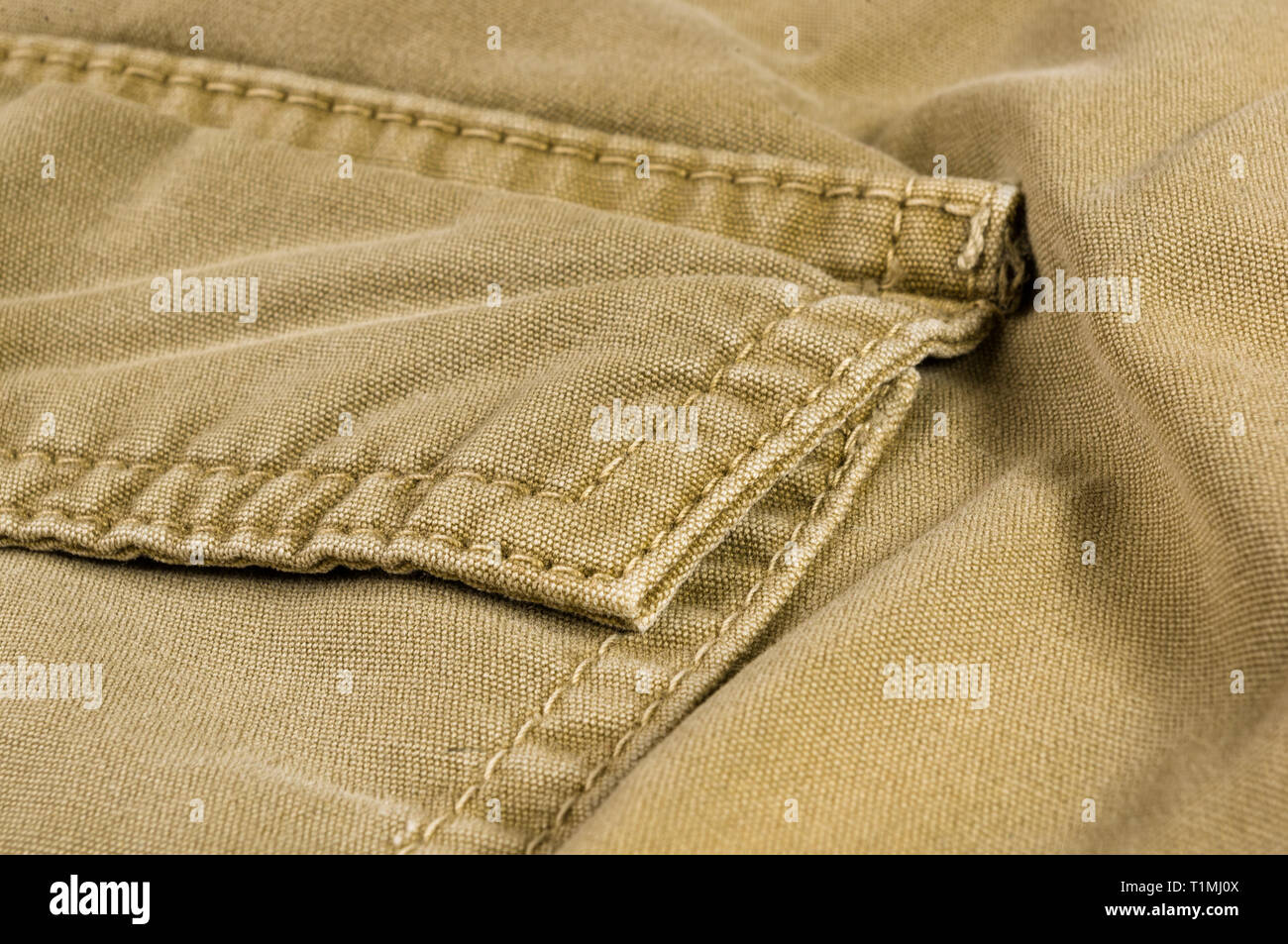 clothing items washed cotton fabric texture with seams, macro, close-up ...