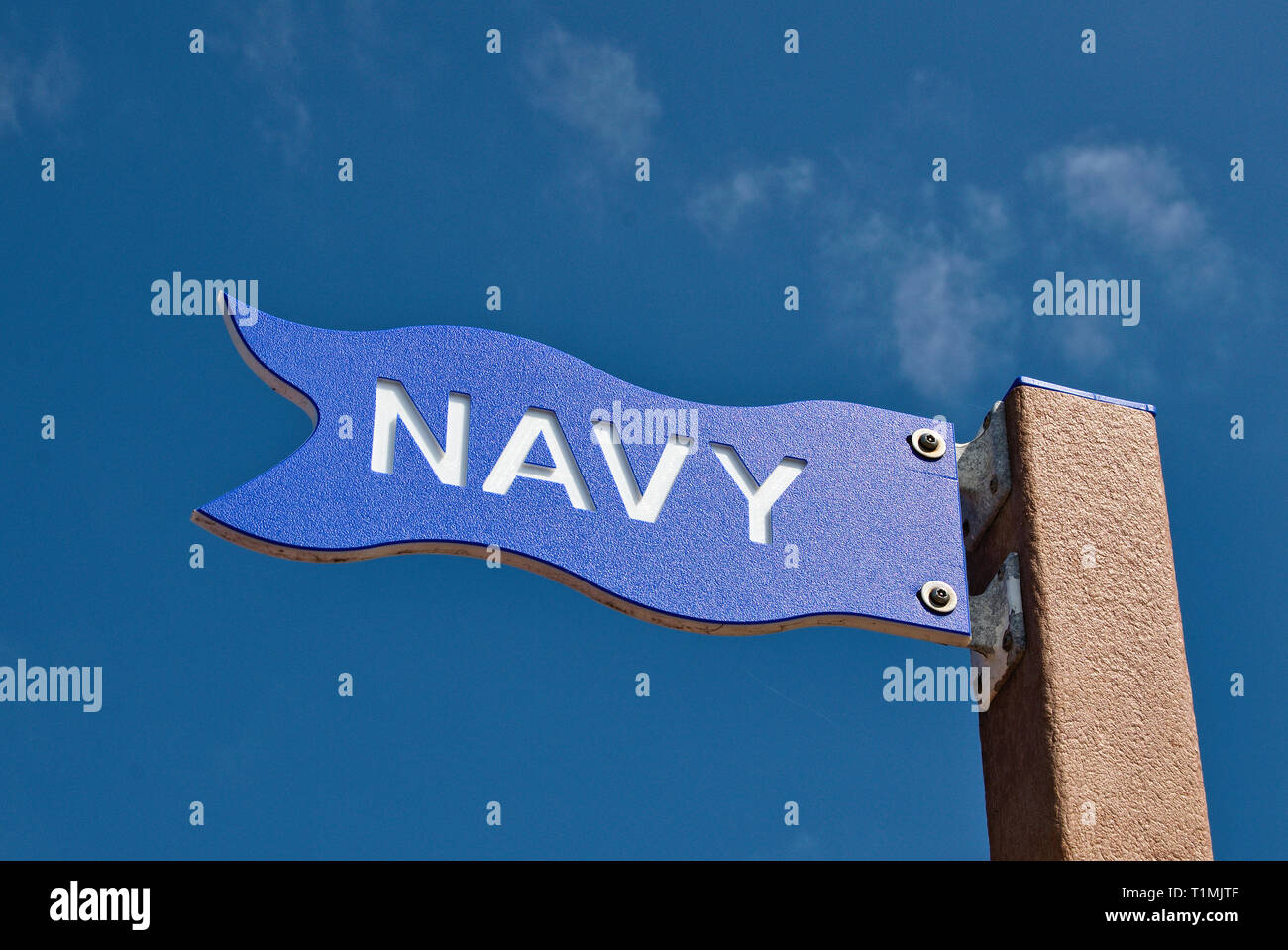 Navy sign with blue sky background Stock Photo - Alamy