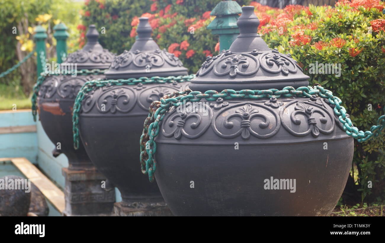 three jars with chain Stock Photo - Alamy