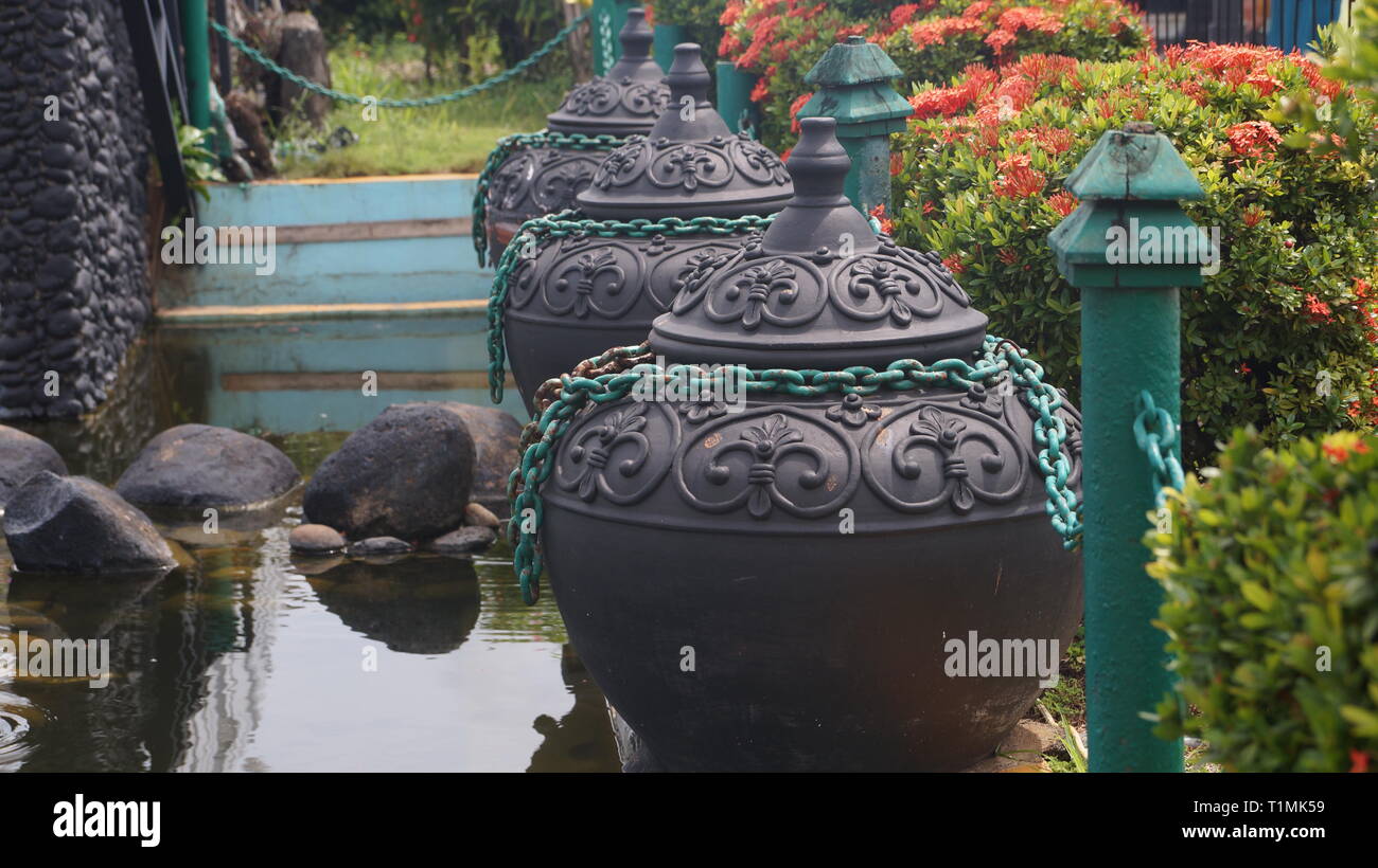 three jars with chain Stock Photo - Alamy