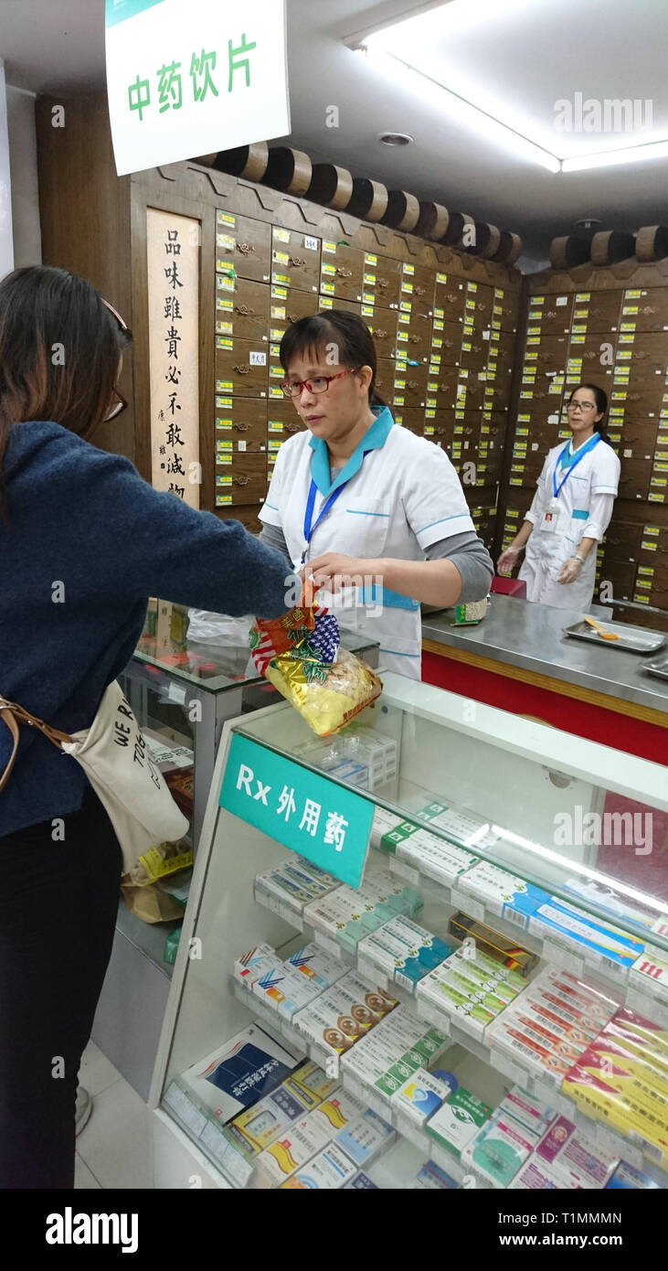 Shenzhen, China: Women pharmacists are processing Chinese medicines for ...
