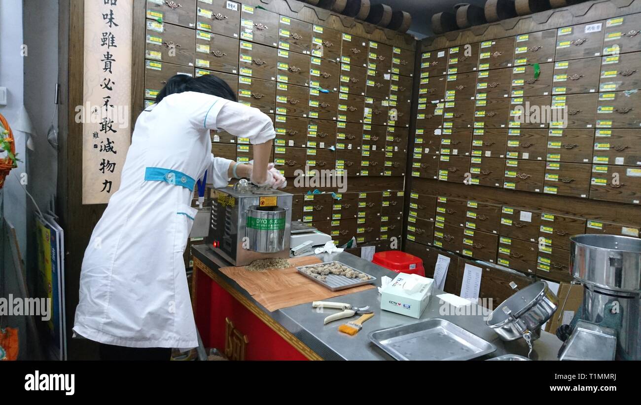 Shenzhen, China: Women pharmacists are processing Chinese medicines for ...