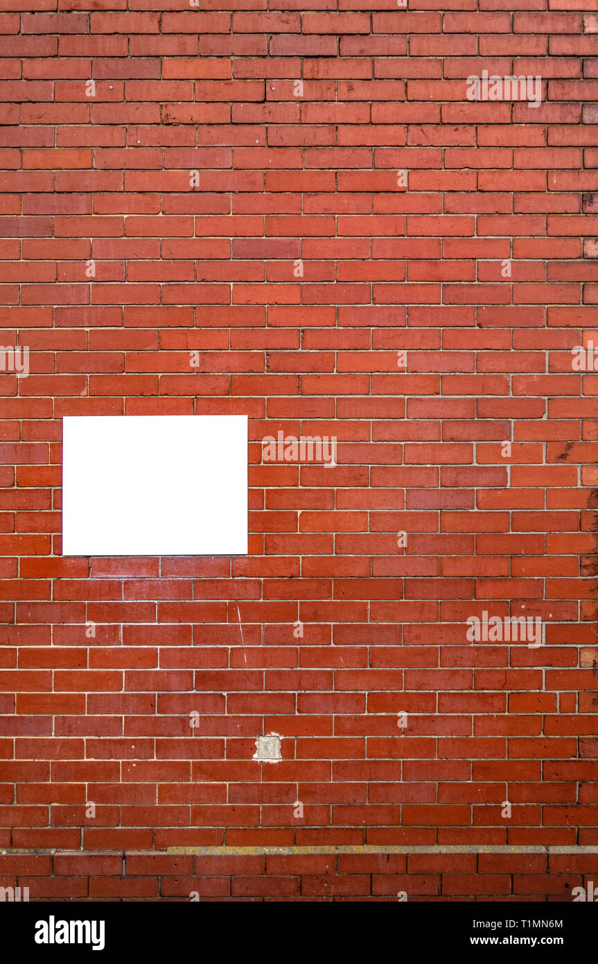 Abstract photograph of a Blank white rectangular sign panel fastened to ...