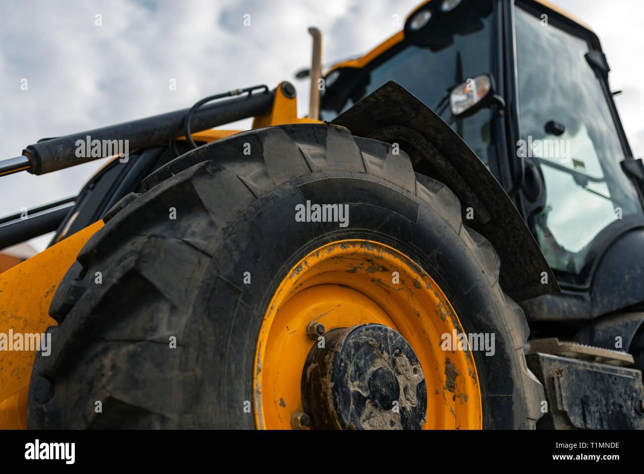 Construction vehicle with loader on building site, industrial heavy ...