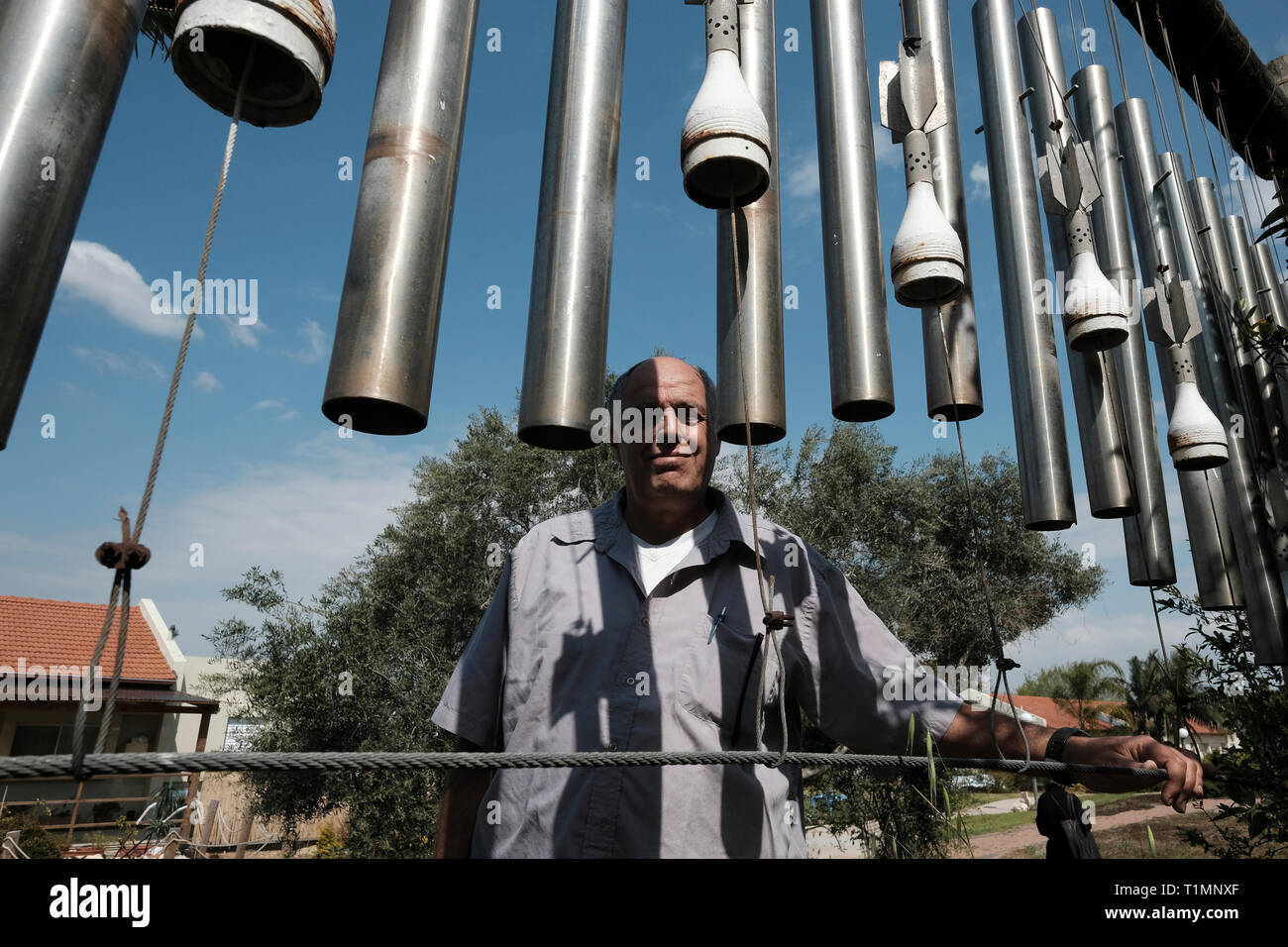 A wind chime made of remnants of exploded mortar shells that were fired ...