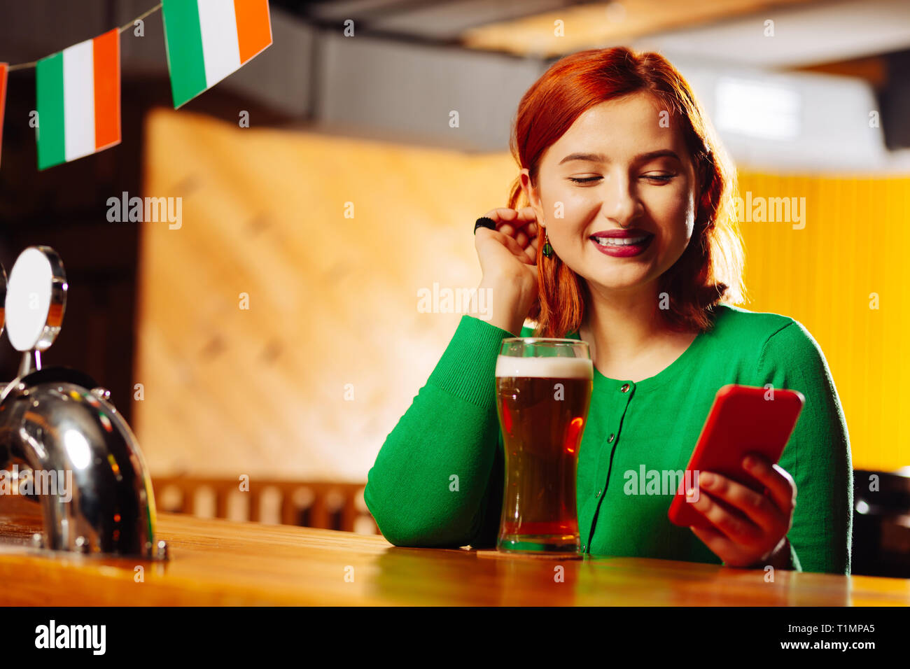 Young woman smiling after receiving message from her boyfriend Stock ... Young woman smiling after receiving message from her boyfriend Stock ...