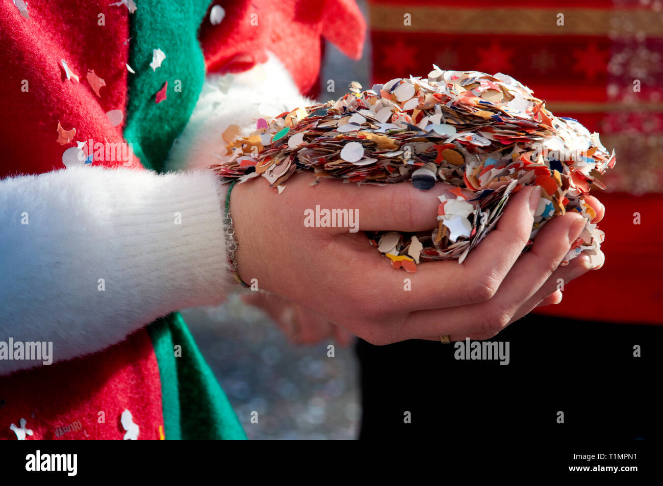 Woman Hand Holding Confetti Stock Photo - Alamy