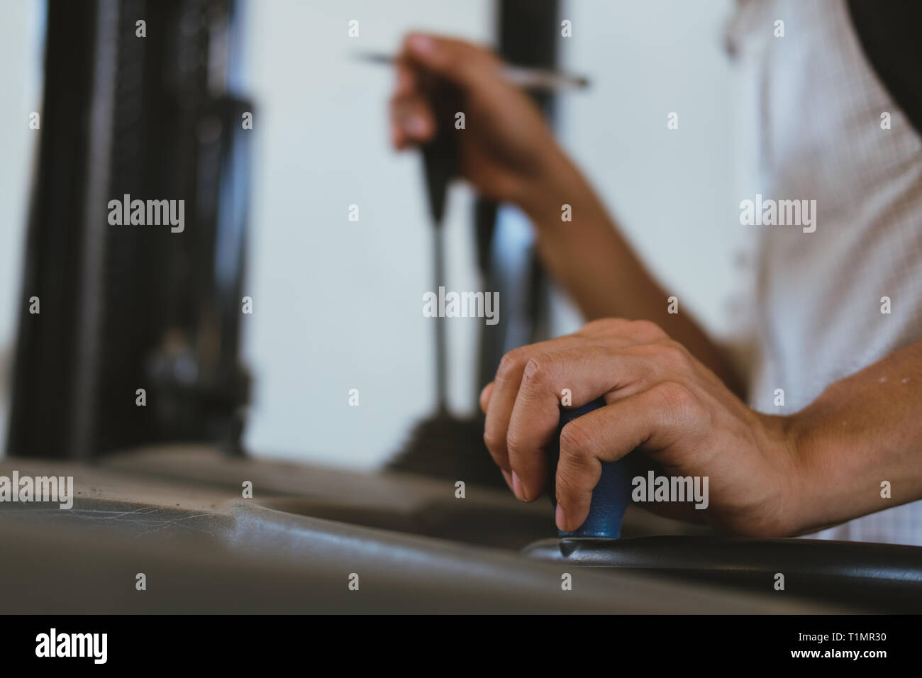 hand operating forklift truck in factory warehouse Stock Photo - Alamy