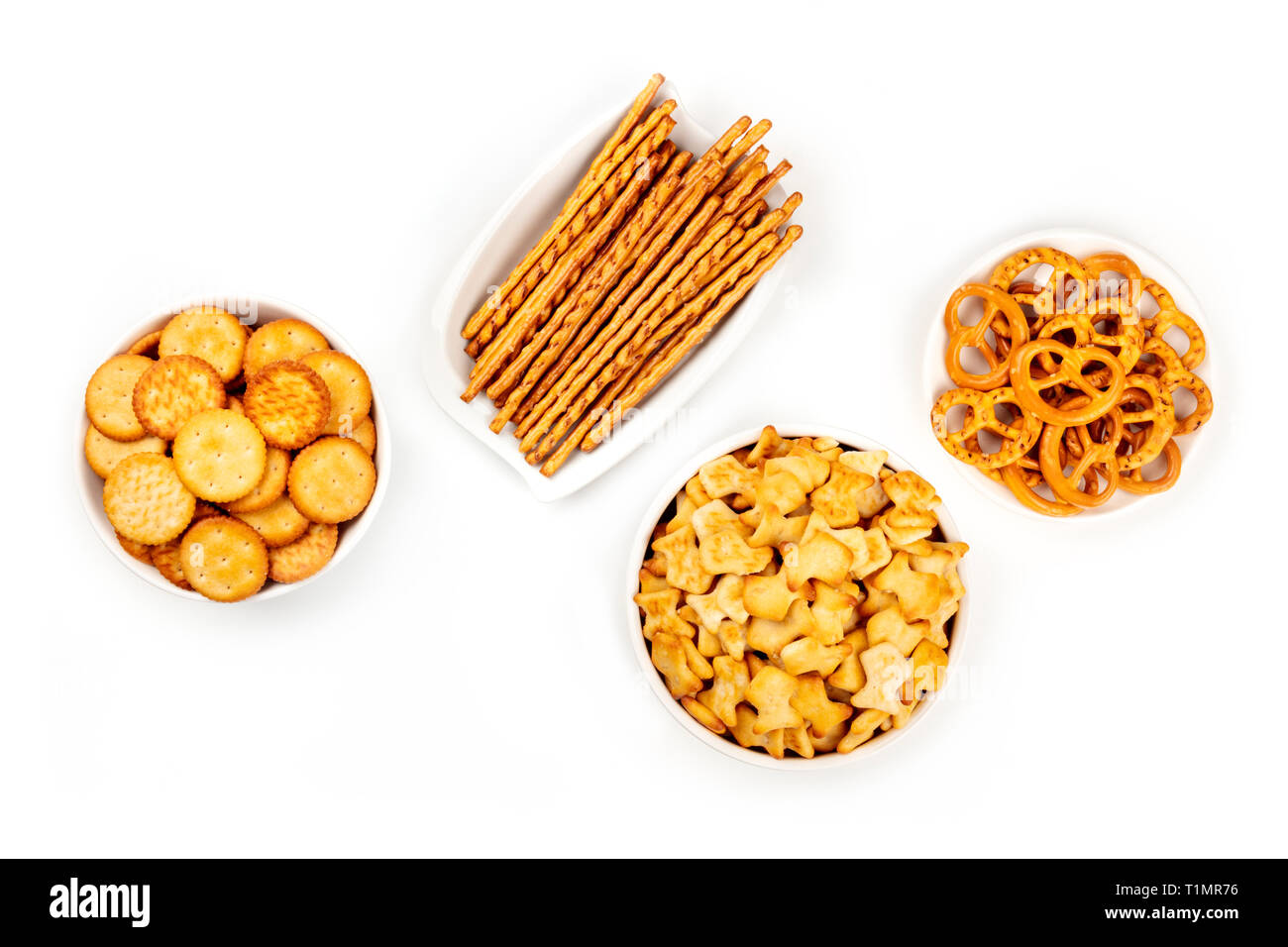 Salty crackers, sticks, pretzels, and goldfishes, shot from the top on ...