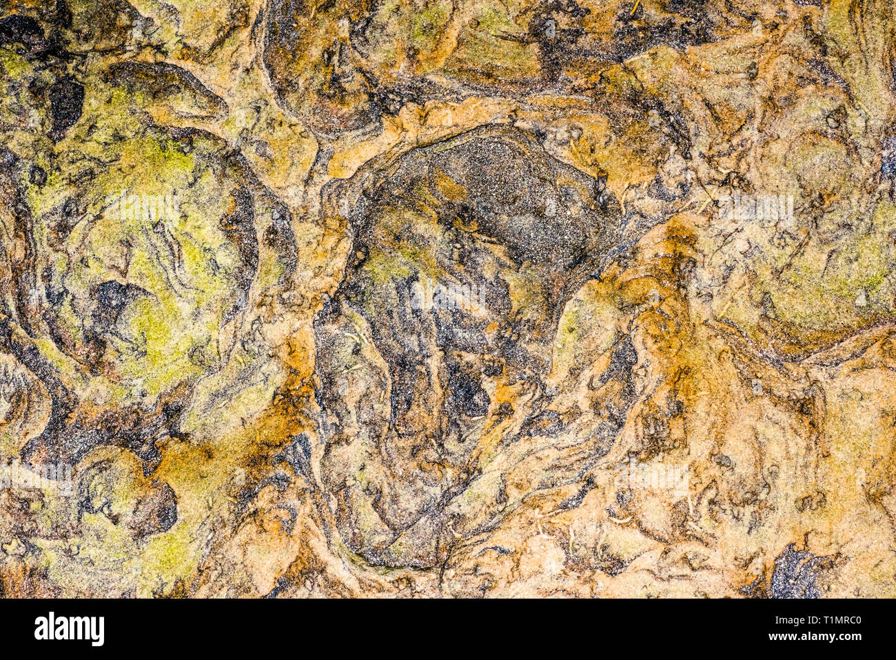 Green, orange, yellow sedimentary rocks - colourful rock layers formed ...