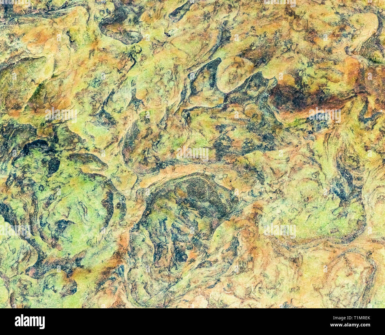 Green, orange, blue and yellow sedimentary rocks - colourful rock ...