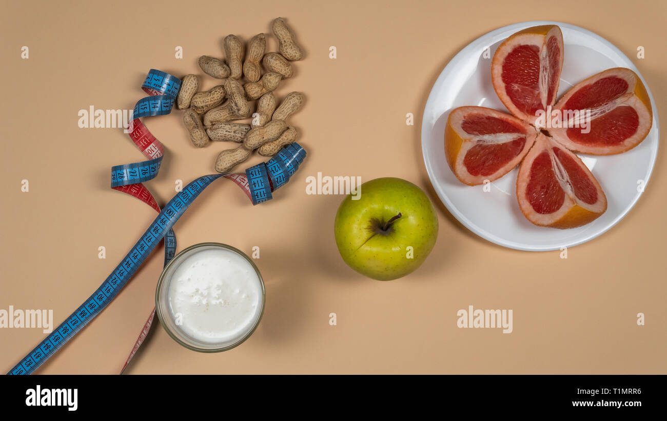 Concept diet - healthy food with apple, grapefruit, peanut, yogurt and ...
