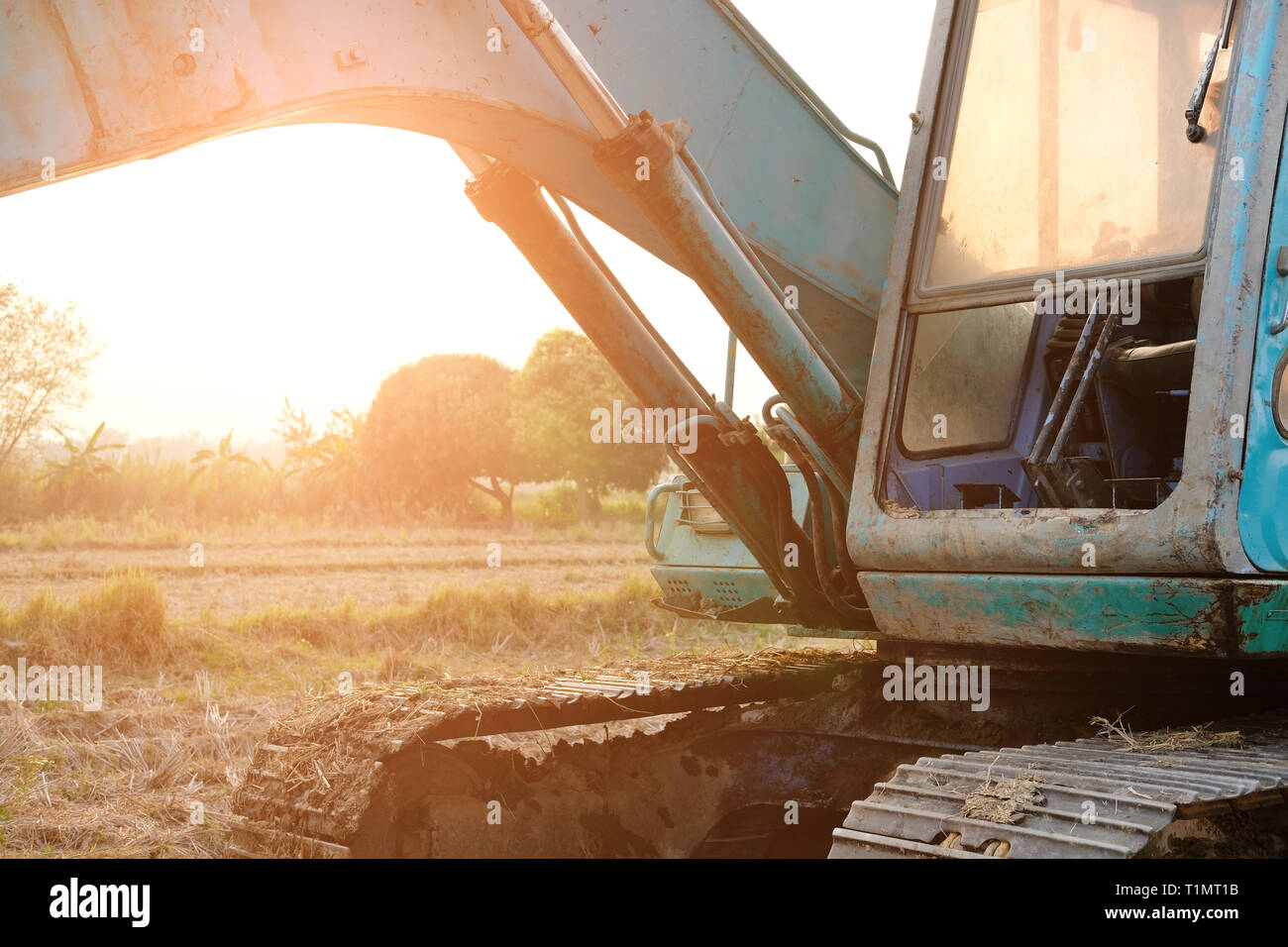 excavator backhoe digger tractor at construction site Stock Photo - Alamy