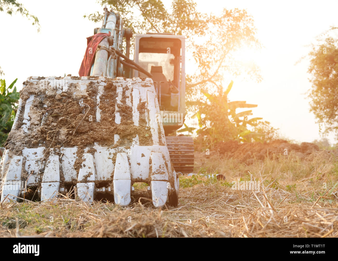 excavator backhoe digger tractor at construction site Stock Photo - Alamy