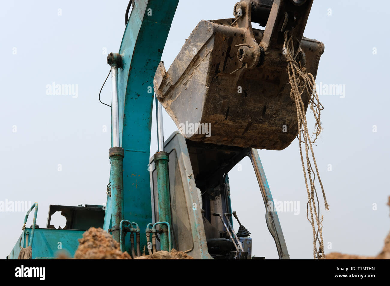 excavator backhoe digger tractor at construction site Stock Photo - Alamy