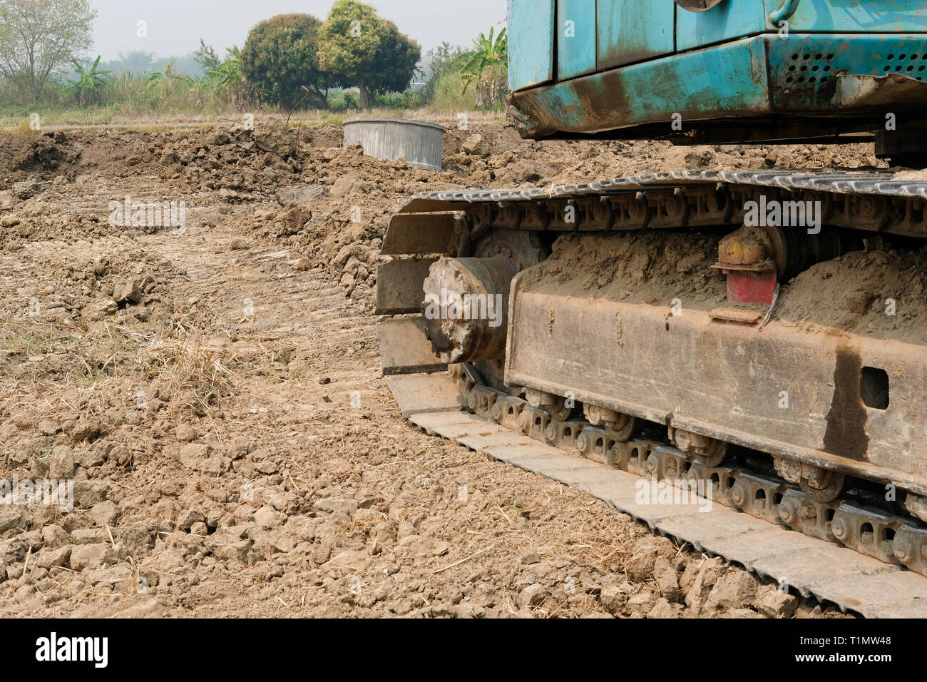 excavator backhoe digger tractor at construction site Stock Photo - Alamy