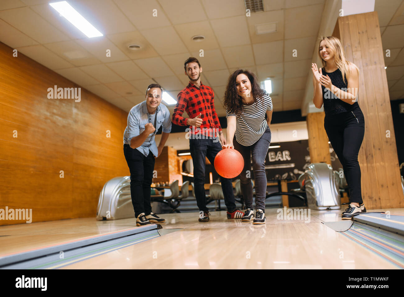 Male bowler throws ball, throwing in action Stock Photo - Alamy