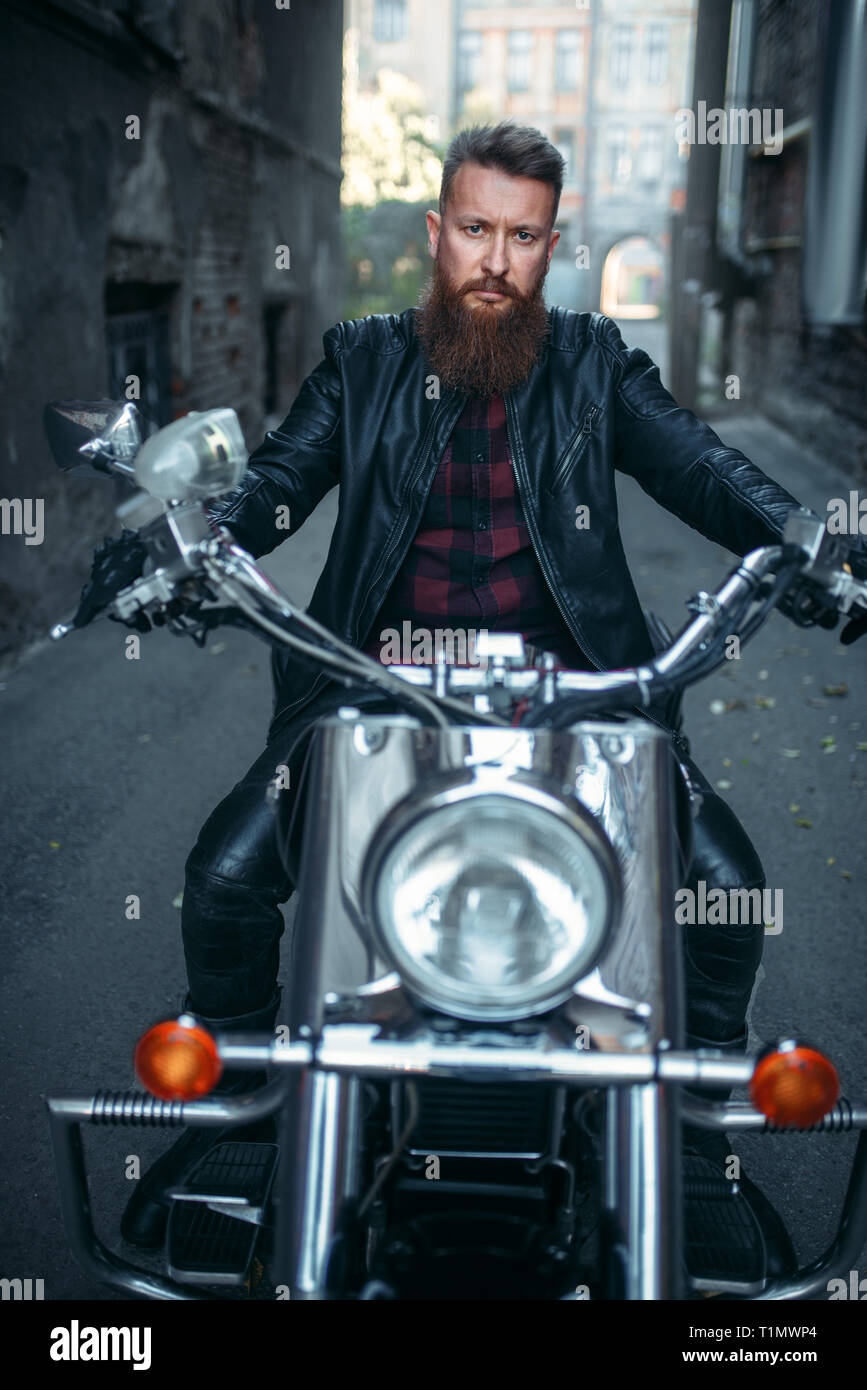 Bearded biker on classical chopper, front view Stock Photo - Alamy