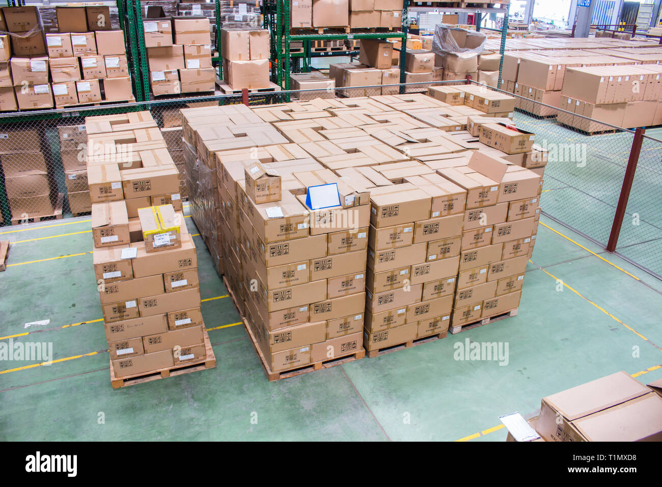 Rows of material boxes or product boxes in warehouse area Stock Photo ...