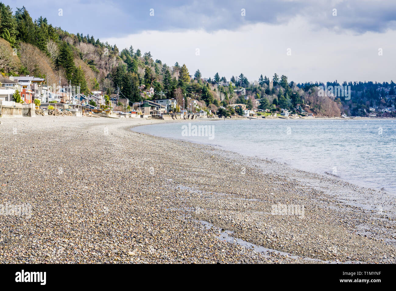 Waterfront homes face the Puget Sound in Burien, Washington. The tide ...