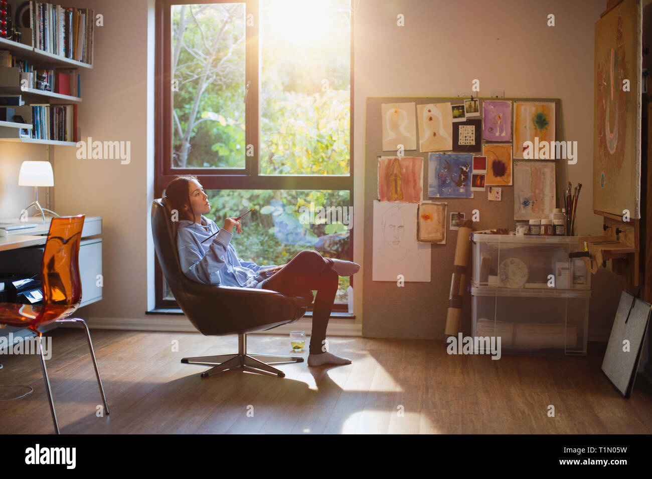 Female artist painting in art studio Stock Photo - Alamy