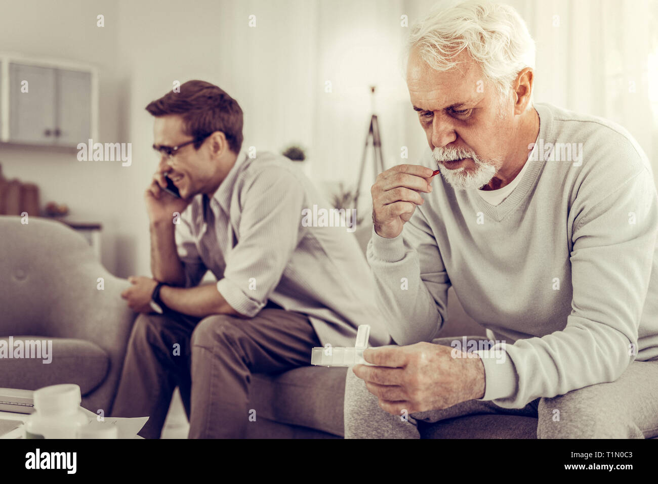 Handsome man taking care sick hi-res stock photography and images - Alamy