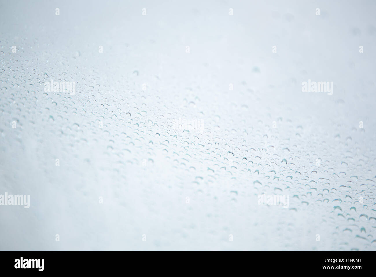Water on glass in front of white shower Stock Photo - Alamy