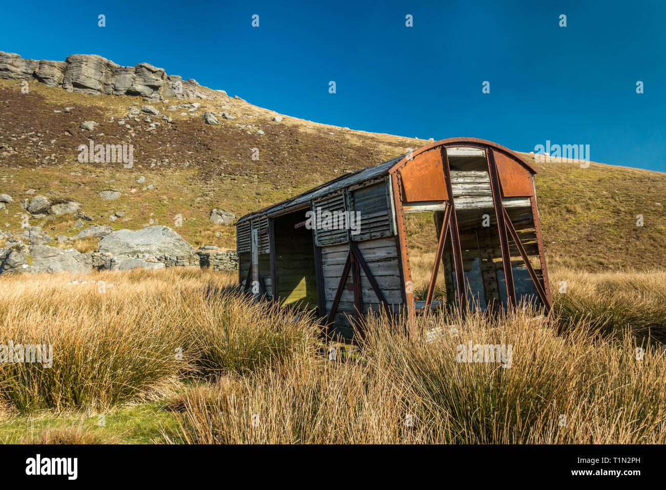 Upcycled railway goods carriage, now shed or barn, in beautiful light ...