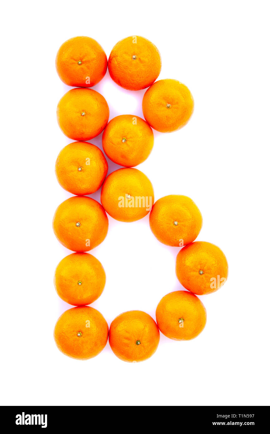 Letter solved with tangerines isolated on white background. Mandarine ...