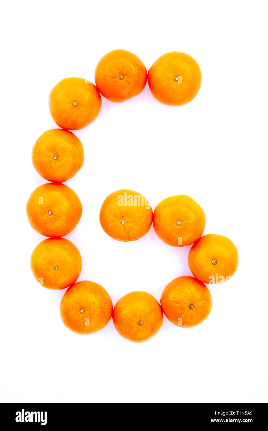 Letter solved with tangerines isolated on white background. Mandarine ...