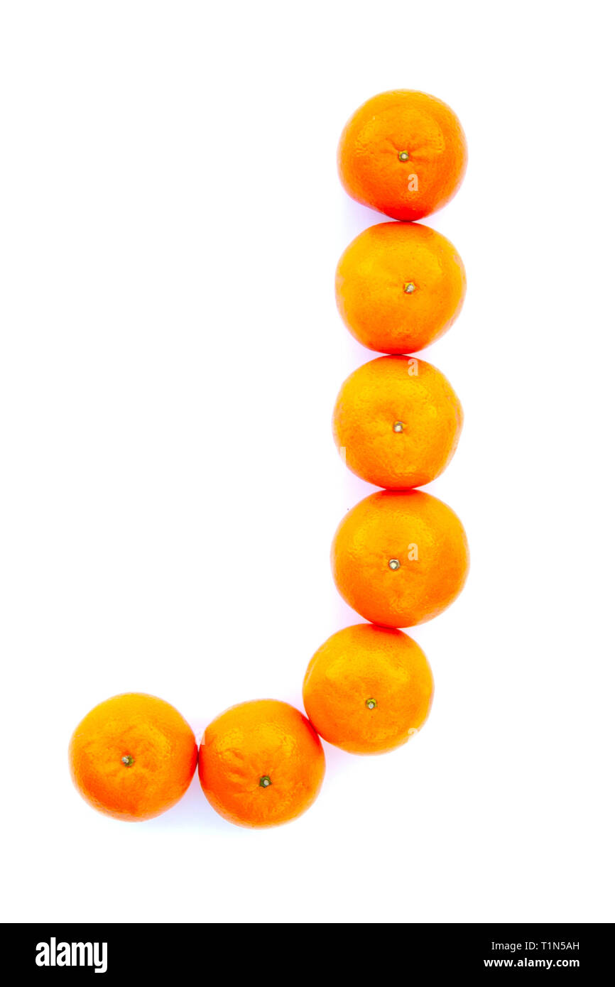 Letter solved with tangerines isolated on white background. Mandarine ...