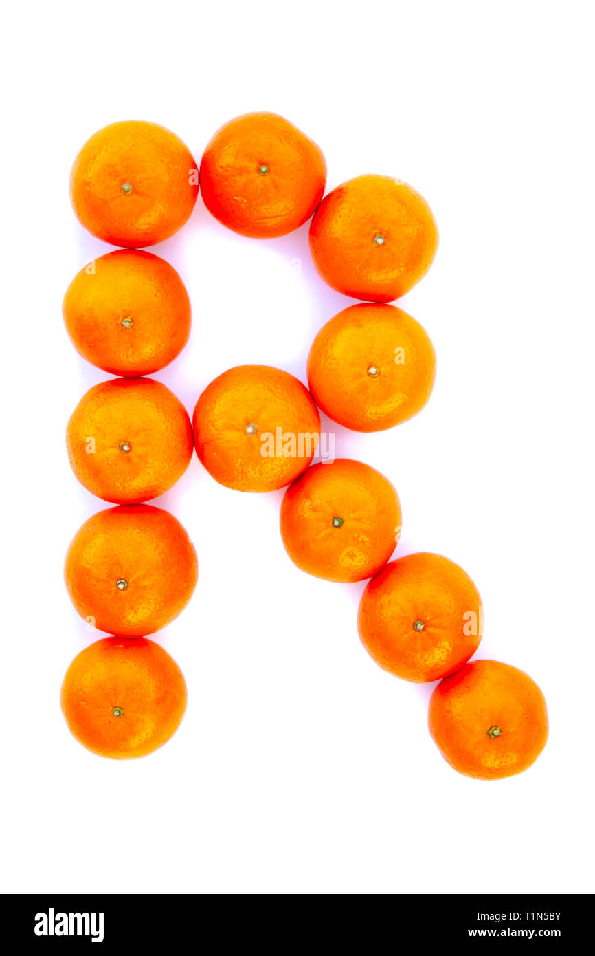 Letter solved with tangerines isolated on white background. Mandarine ...