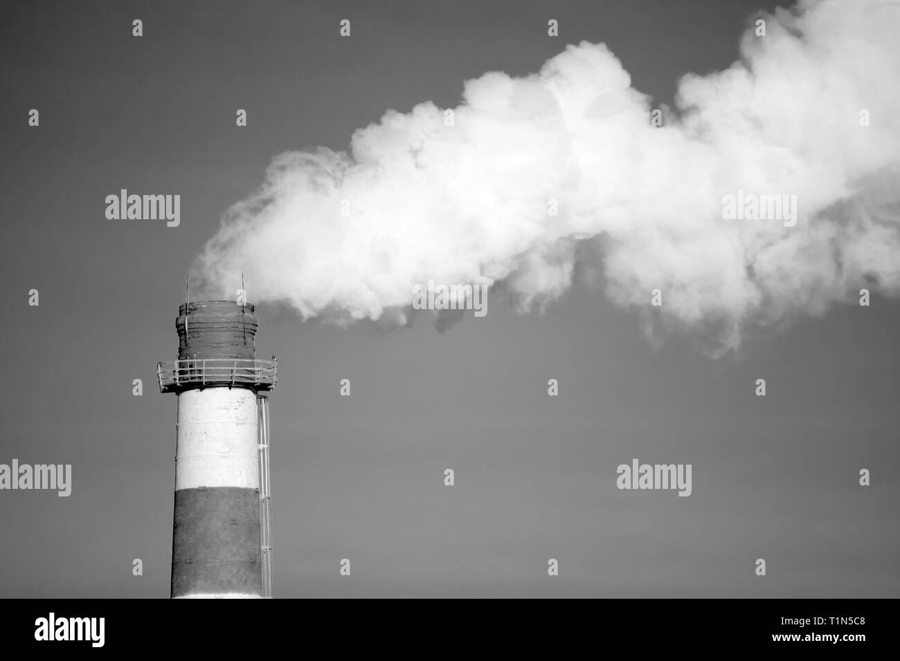 pipe throws steam on sky background black and white toned Stock Photo ...