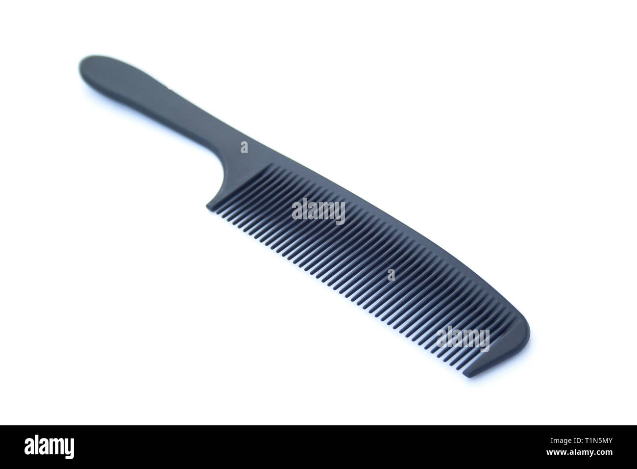 Black comb isolated on white background Stock Photo - Alamy