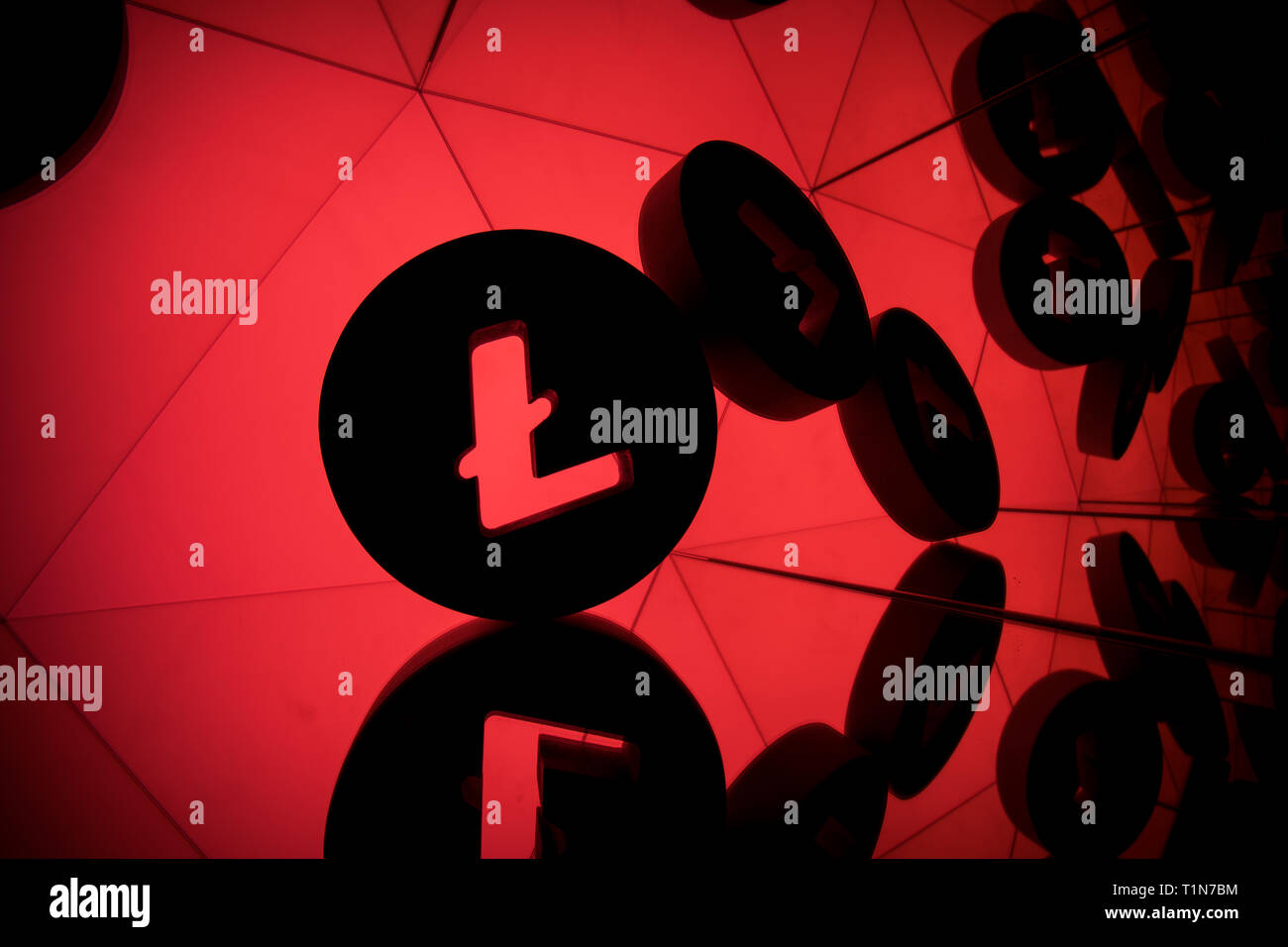 Litecoin Currency Symbol With Many Mirroring Images of Itself on Red ...