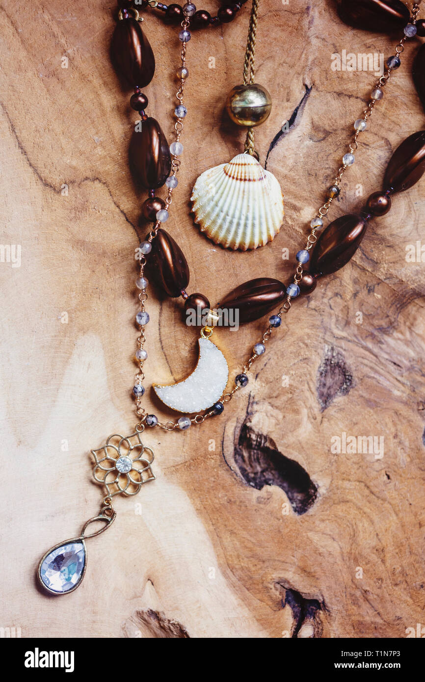 Necklace collection on wooden background Stock Photo - Alamy